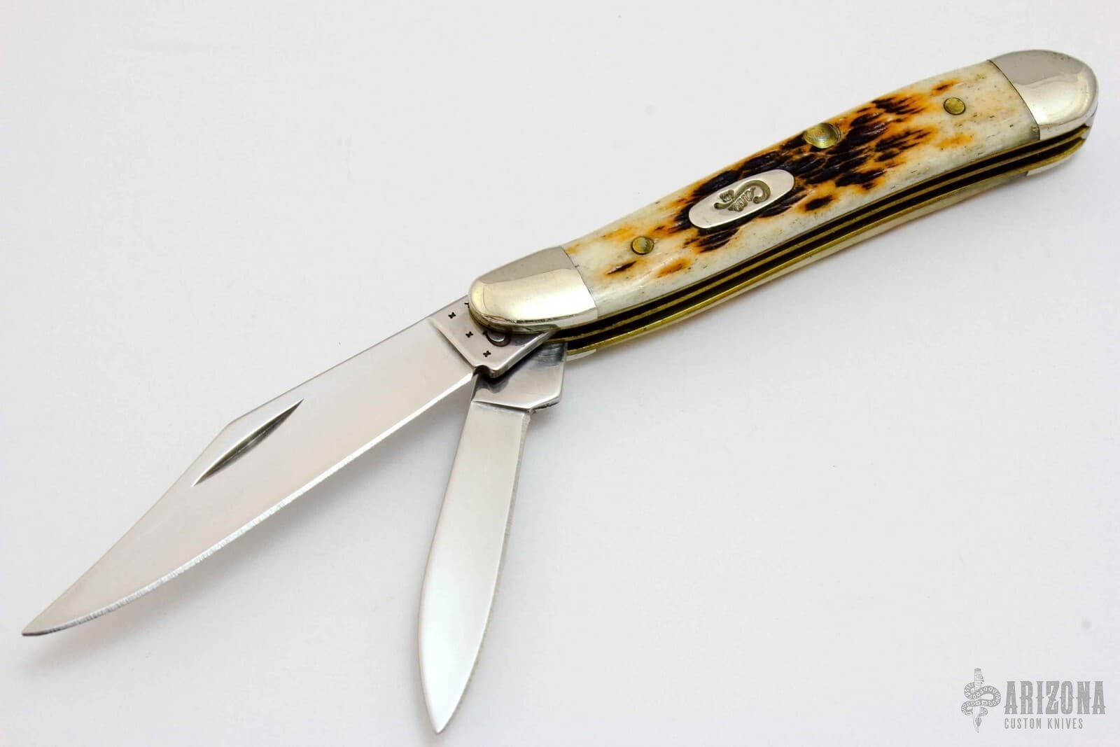 6220 SS Amber Jigged Bone Peanut - Arizona Custom Knives